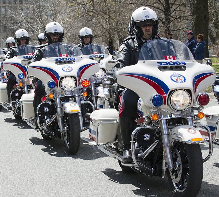 oronto Police motorcycle officers ride in honour of fallen officers ...